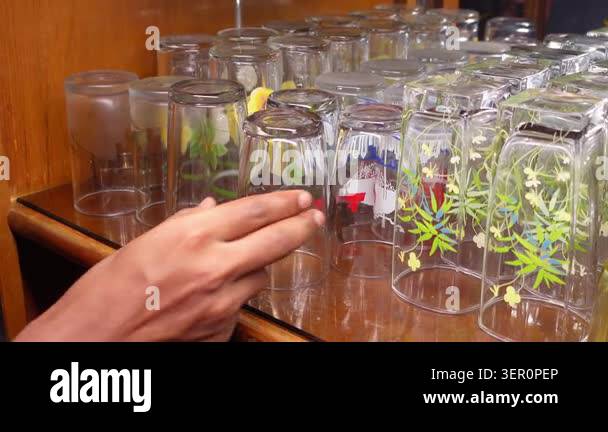 Close-Up of Hand Taking a Clean Drinking Glass from a Shelf Stock Video ...
