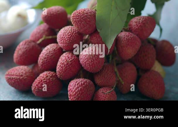 Fresh lychee fruit is shown being sold at a market stand Stock Video ...