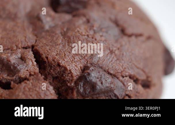 Baker prepares chocolate cookies with chocolate chips in the kitchen ...