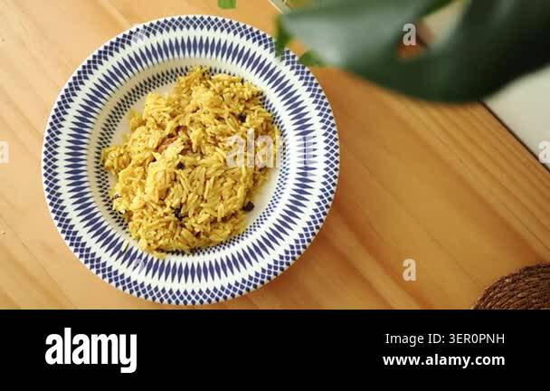 Overhead View of Yellow Rice Dish on Wooden Table Stock Video Footage ...