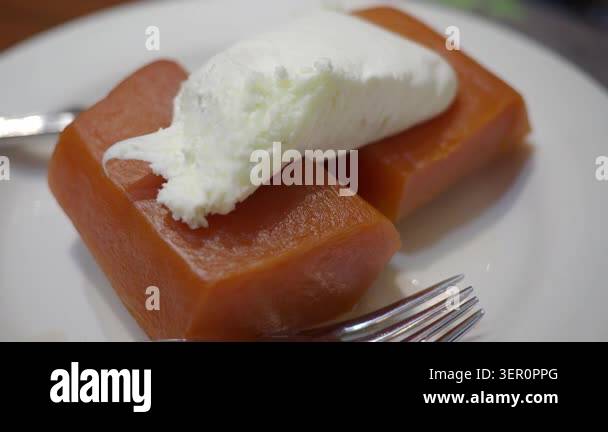 Traditional Quince Dessert with Cream on a White Plate Stock Video ...