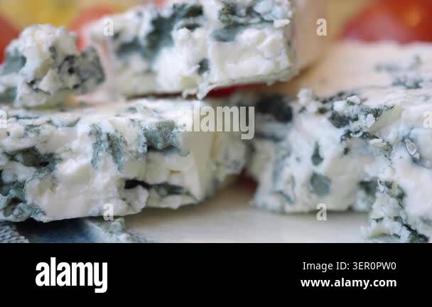 A chef prepares blue cheese with care in a kitchen space Stock Video ...