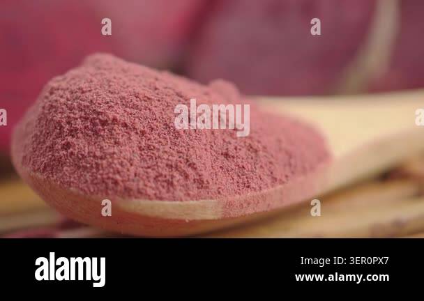 beetroot Powder on a wooden spoon in closeup Stock Video Footage - Alamy