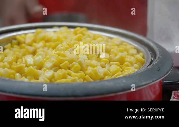 Corn is cooking in a pot on the stove in a home kitchen Stock Video ...
