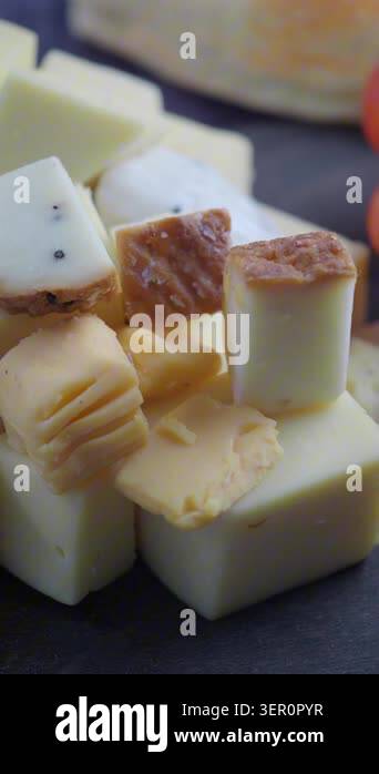 Guests enjoy cheese cubes and cherry tomatoes at a social event Stock ...