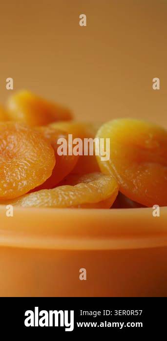 Close look at dried apricots in a bowl for snacking or cooking Stock ...