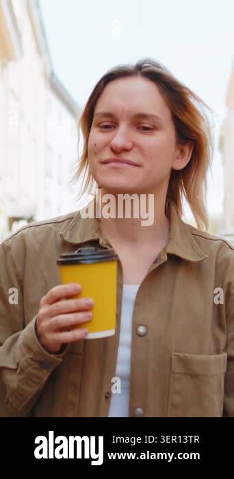 Happy Caucasian young woman enjoying morning coffee hot drink and ...