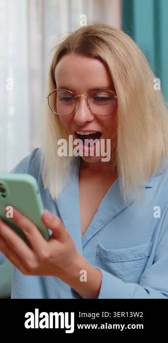 Oh my God Wow. Excited happy joyful winner young woman freelancer using ...