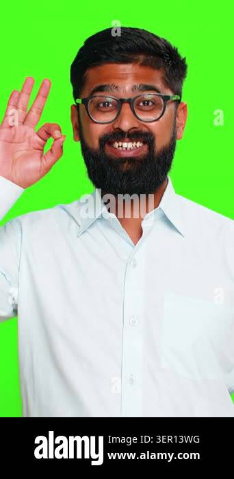 Indian man makes okay hand gesture with cheerful smile expressing ...