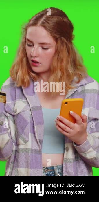 Happy caucasian woman using credit bank card and smartphone while ...