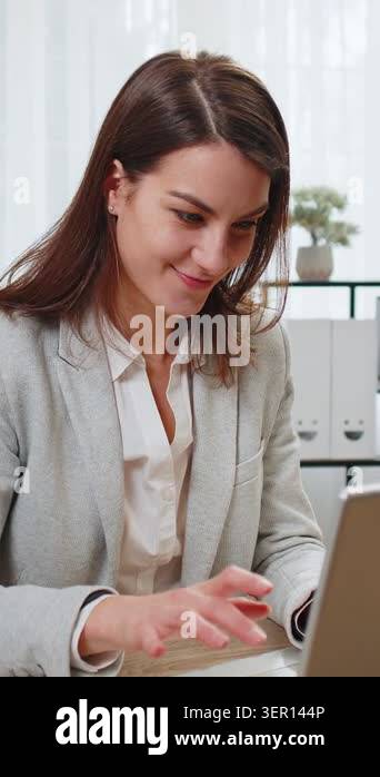 Happy businesswoman freelancer taking break leaning on chair after ...