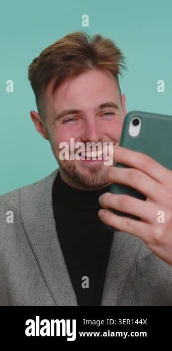 Happy tourist business man looking smartphone display sincerely ...