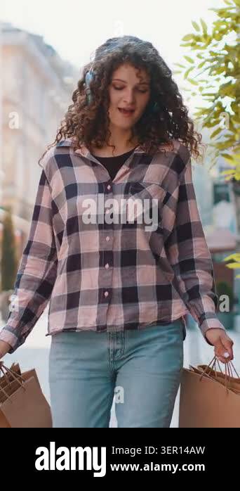Happy smiling pretty young woman shopaholic consumer after shopping ...
