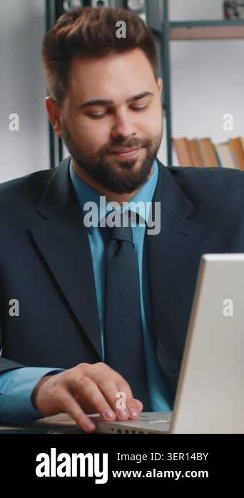 Caucasian businessman sitting at home office workplace desk closing ...