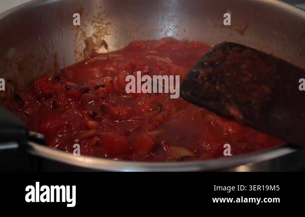 A mixture of bacon bits, onions and tomatoes close-up cinematic view ...