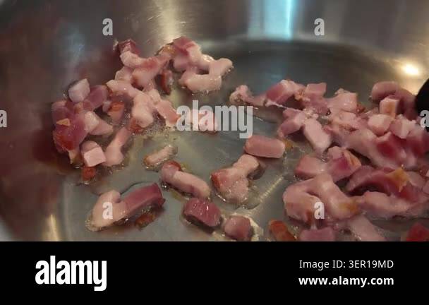 Cooking pork bacon bits close-up cinematic view. Macro shot of cooking ...