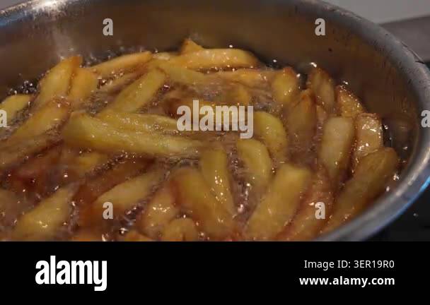 Cooking Crispy French Fries close-up cinematic view. Macro shot of ...
