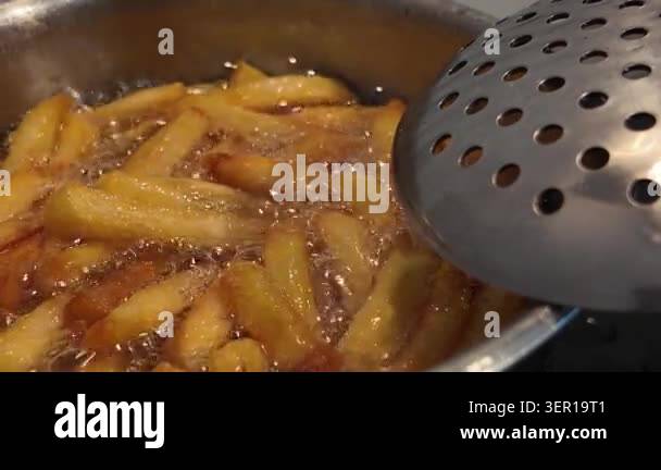 Cooking Crispy French Fries close-up cinematic view. Macro shot of ...