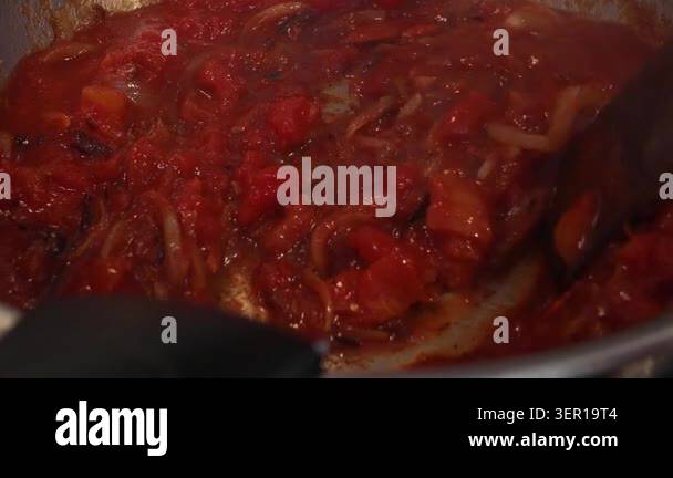 A mixture of bacon bits, onions and tomatoes close-up cinematic view ...