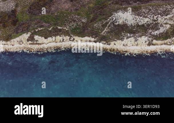 A clear view of the coast showing the meeting point of land and water ...