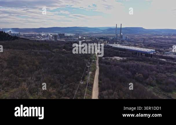 Landscape shows an industrial area with factories and smokestacks in ...