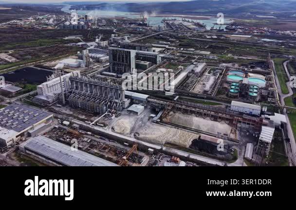 A large industrial area with multiple factories and storage facilities ...
