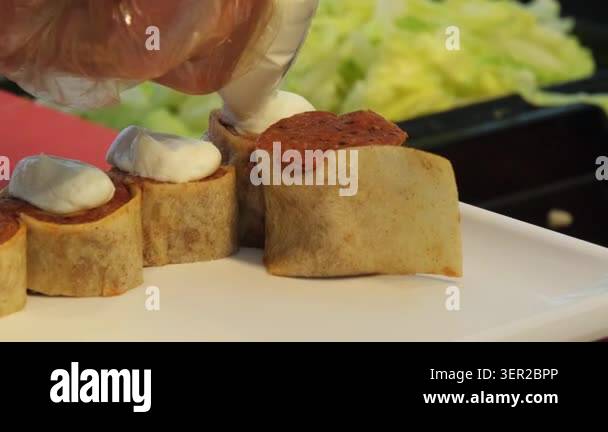 A detailed close up video showing fresh white yogurt being squeezed ...
