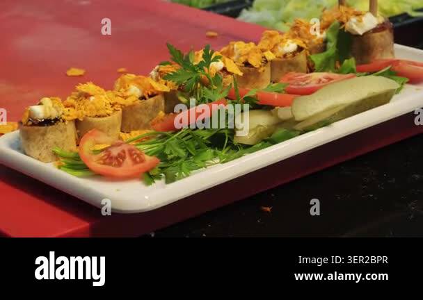A detailed close up video of unique cig kofte sushi rolls topped with ...