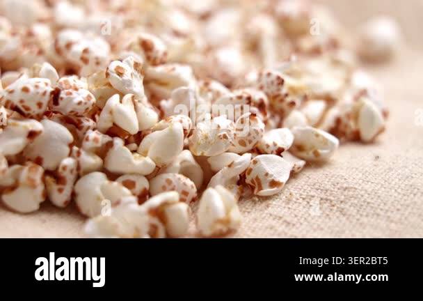 White crunchy puffed buckwheat grains on rough fabric. Fitness ...