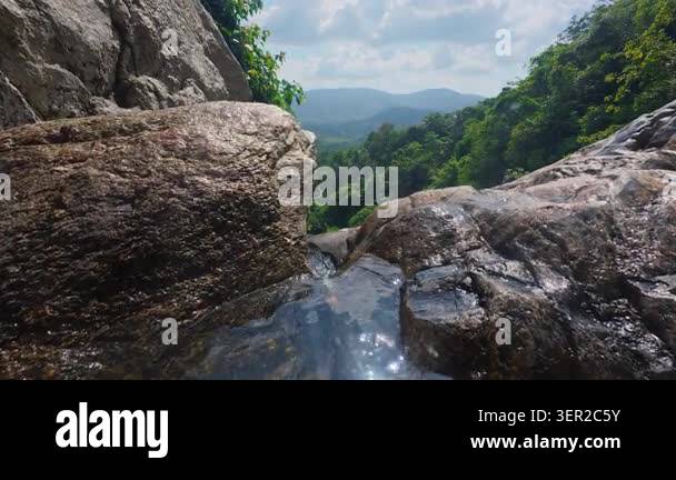 View from Na Muang Waterfall 2 on Koh Samui, Thailand, with wet granite ...