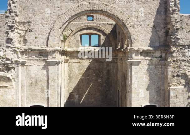 Drone zoom in through the gate of ruins of old cathedral in Kastav ...