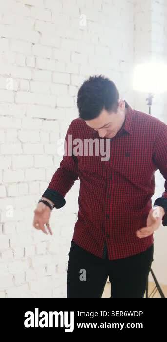 Middle age female and young man is dancing kizomba in studio, close up ...