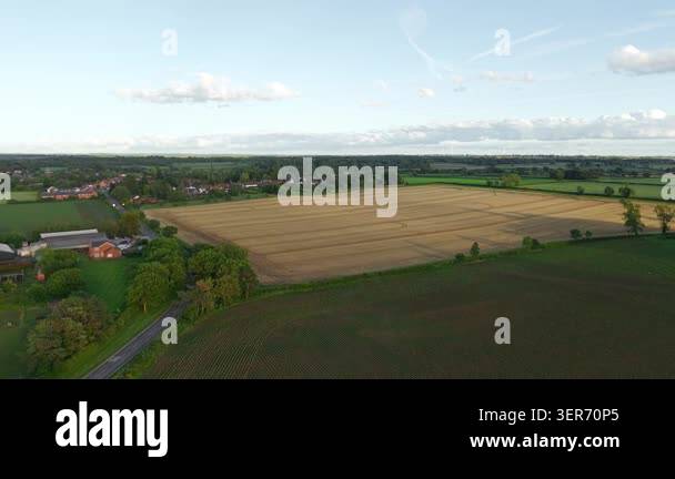 Rural farmland and harvested crop fields near countryside village ...