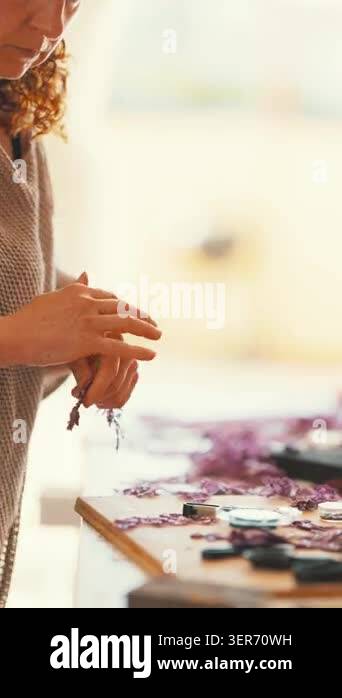 Focused artisan carefully crafting intricate handmade jewelry from ...