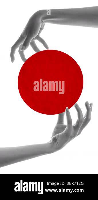 Hands holding red divided circle on gray background minimal stop motion ...