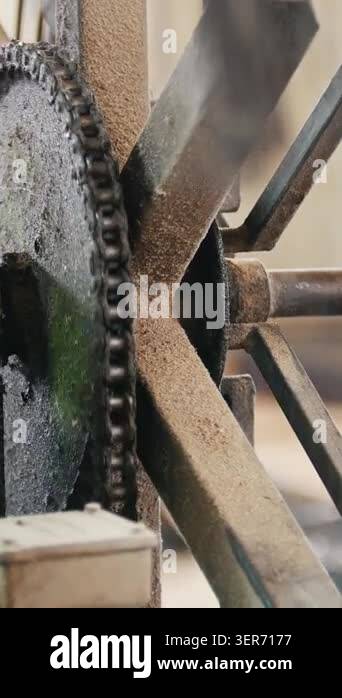 Close up view of rotated chain gear - part of industrial machinery ...