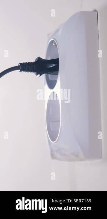 Mans hand puts it the wall plug socket, close up Stock Video Footage ...