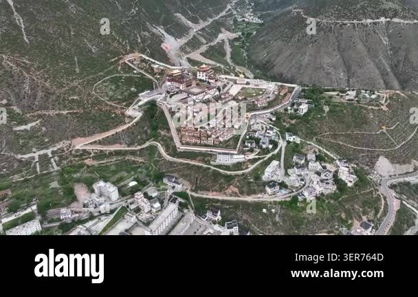 Aerial view of traditional Tibetan temple buildings in Daocheng Yading ...
