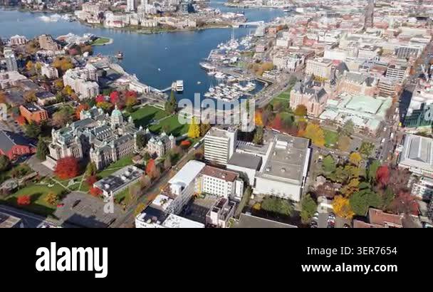 Parliament Buildings, Aerial drone footage flying over a city with a ...