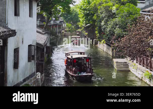 Chinese Jiangnan narrow river with slow moving boats Stock Video ...