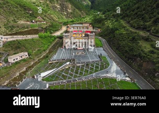 Aerial view of single Tibetan landmark building on mountain terrace of ...