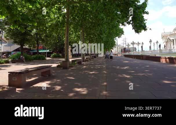 Skopje, North Macedonia, June 2, 2026. A tree-lined promenade with ...