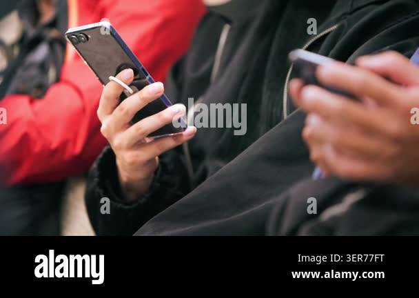 Slow motion close view of an unrecognizable metro passenger holding a ...