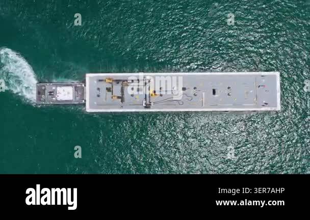 Cargo barge ship in sea, aerial view. Freight container loaded on cargo ...