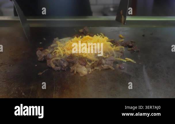 Chef cooking meat on a hot flat grill for street food Stock Video ...