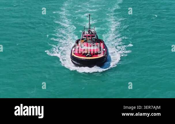 Tugboat sea transportation. Boat tug at sea. Aerial footage of tow boat ...