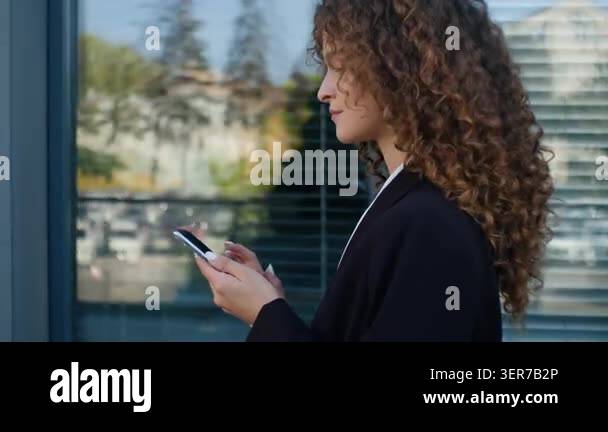 Side view concentrated pensive Caucasian business woman texting mobile ...