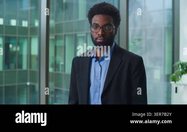 Serious African American business man look away turning looking at ...