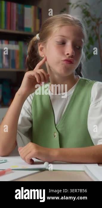 Hesitate pensive thinking Caucasian little girl coming up with idea ...
