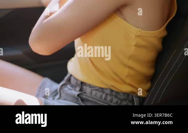 Close up unrecognizable woman female girl unknown driver car fastening ...